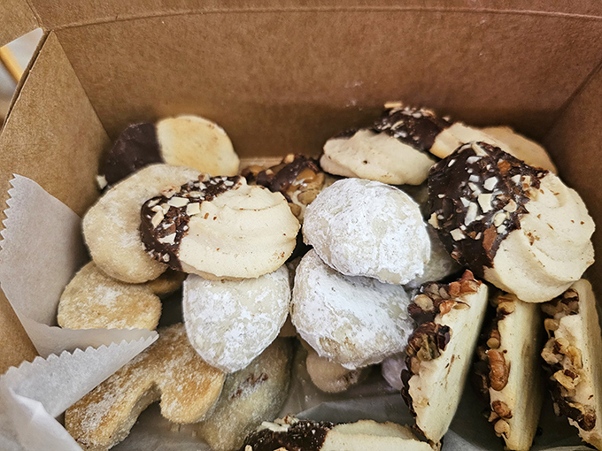 Cookie box paradise &ndash; where powdered sugar snowballs and chocolate-dipped delights coexist in perfect harmony. Resistance is both futile and unnecessary.