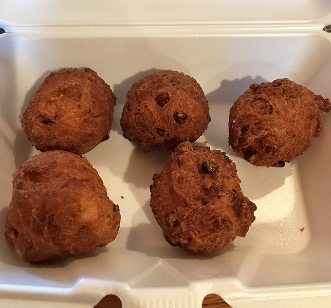 Sweet corn fritters dusted with powdered sugar prove that sometimes dessert disguises itself as comfort food.