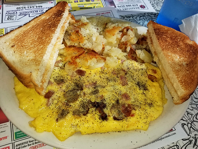 The breakfast trifecta: perfectly scrambled eggs, home fries with just the right amount of crust, and toast ready for its butter baptism.