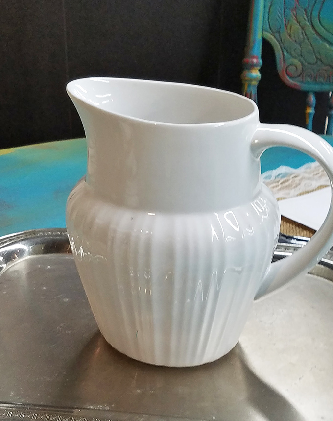 This pristine white pitcher has probably poured cream into thousands of coffee cups during conversations that changed lives.