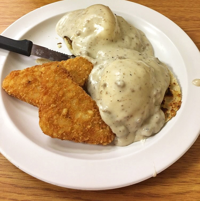 Behold the Country Benedict—where biscuits replace English muffins and gravy trumps hollandaise. It's breakfast with a Southern drawl and a wink.