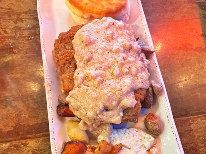 Country fried steak swimming in creamy gravy atop a bed of potatoes&mdash;Southern comfort that sticks to your ribs and soothes your soul.
