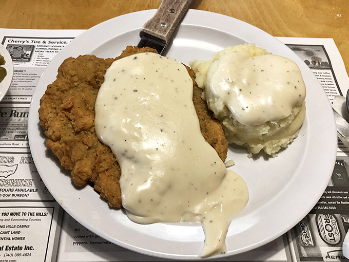 Country fried steak smothered in gravy so good you'll want to write it love letters. Comfort food that hugs you from the inside.