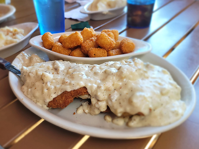 Country fried steak swimming in gravy&mdash;comfort food so good it should come with a warning: "May induce spontaneous sighs of contentment."