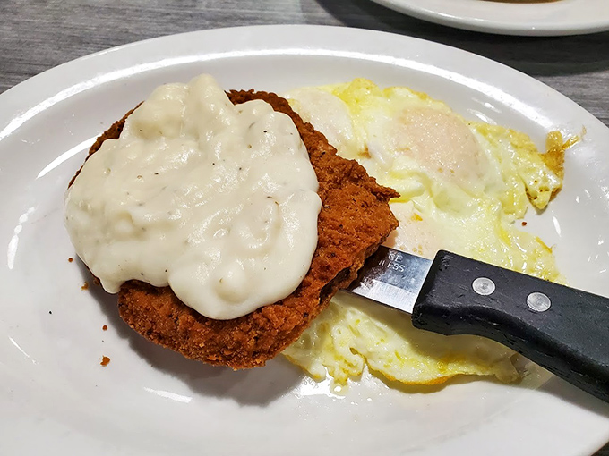 Country fried steak smothered in gravy that would make your grandmother both jealous and proud. Comfort food that hugs your soul.