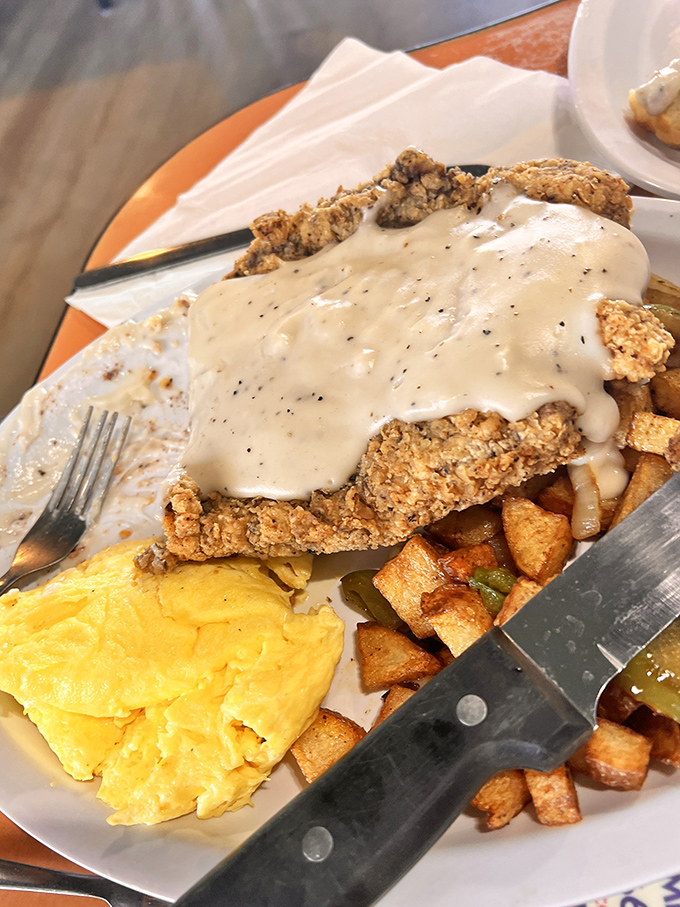 Country fried steak smothered in gravy alongside golden eggs&mdash;the breakfast equivalent of a warm hug from your favorite aunt.