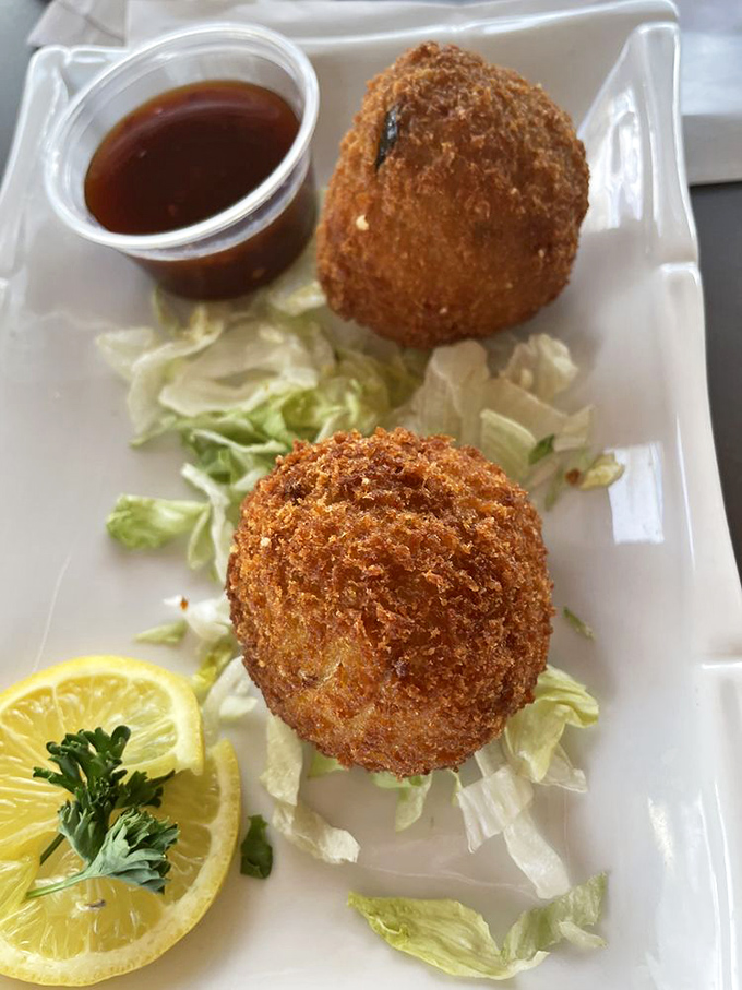 Crab balls with attitude! These golden spheres of joy prove that sometimes the best things in life are round, crispy, and served with sauce.