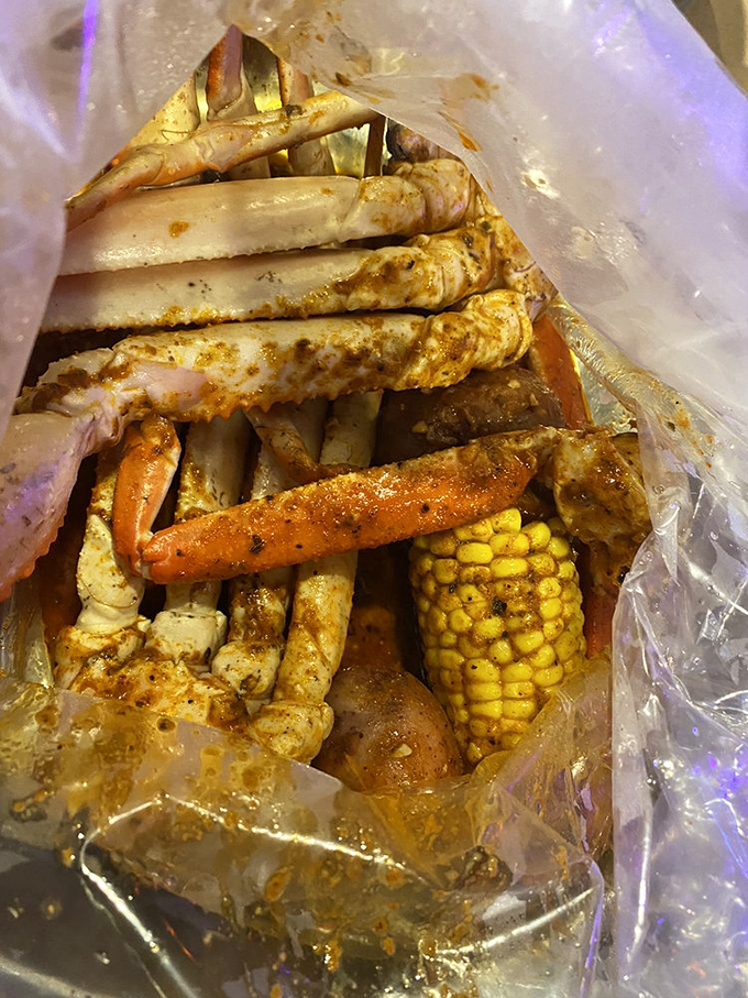 Snow crab legs emerge from their seasoned steam bath looking like golden underwater royalty ready for consumption.