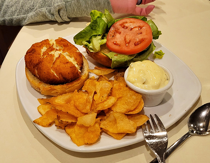A golden-brown crab cake sandwich that doesn't hide behind fillers &ndash; just pure Maryland-style crab meat ready for its close-up.