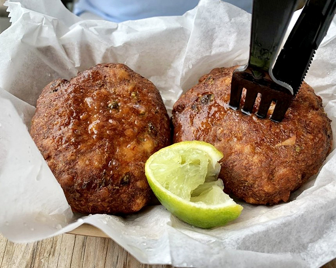 These golden beauties pack more sweet crab meat than should be legally allowed in one perfect patty.