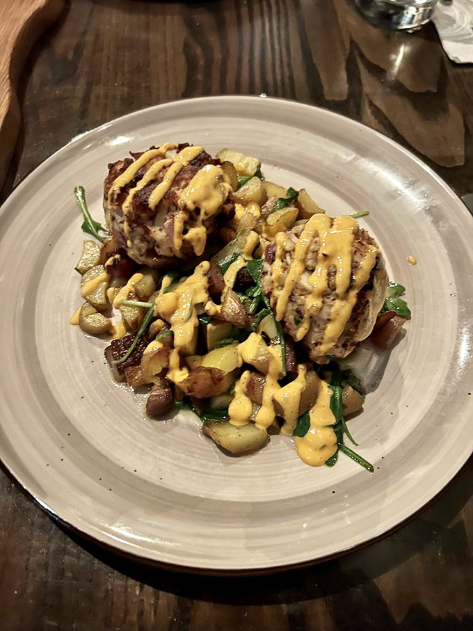 These crab cakes aren't just browned &ndash; they're caramelized to perfection, with a sauce drizzle that should have its own Instagram account.