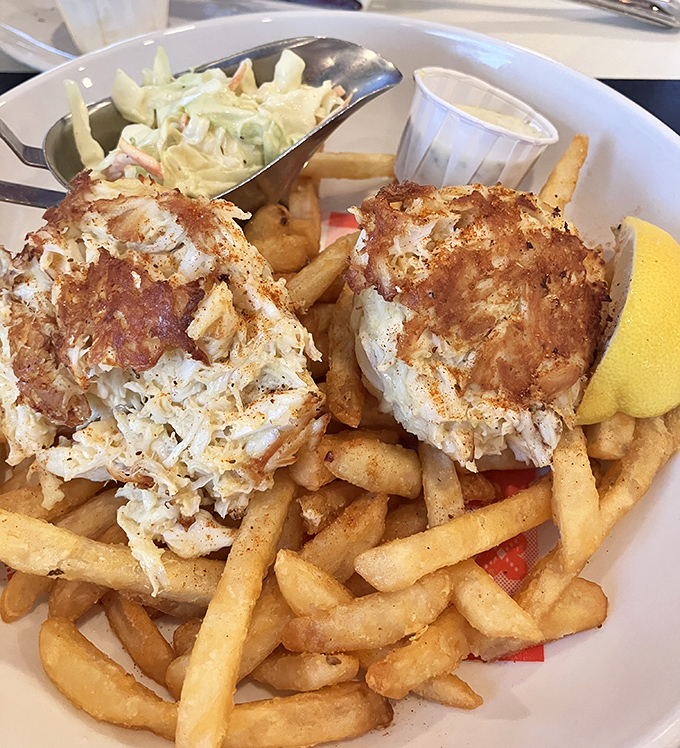 These golden-brown crab cakes are what dreams are made of&mdash;mostly crab, minimal filler. Served atop hand-cut fries, they're the definition of simple perfection.