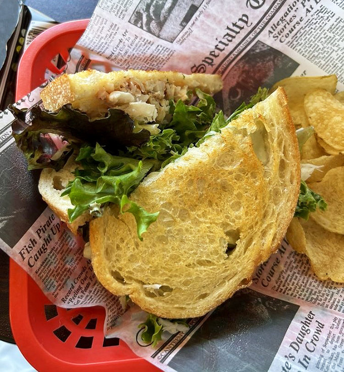 Sandwich architecture at its finest. Golden toasted bread barely containing a generous heap of sweet crab meat&mdash;a handheld masterpiece of coastal cuisine.