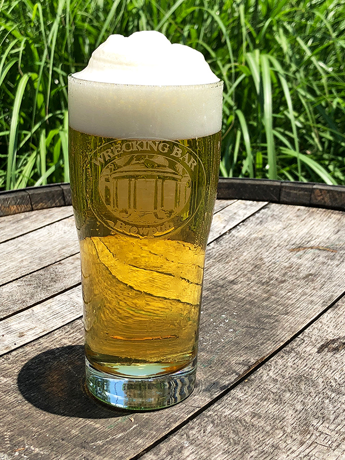 A perfect pour with the brewpub's logo proudly displayed&mdash;this beer isn't just photogenic, it's practically auditioning for its own reality show.