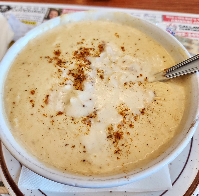 This cream of crab soup isn't just a starter; it's a warm, velvety hug in a bowl, sprinkled with spices that whisper "Maryland shore is just next door."