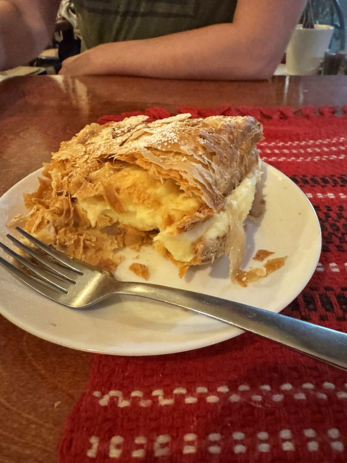 This cream-filled pastry isn't just dessert&mdash;it's architecture. Flaky layers collapse with each forkful, creating a sweet avalanche worth every calorie.