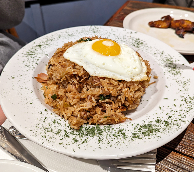 Arroz con... everything! This mountain of Cuban fried rice crowned with a sunny-side-up egg is breakfast, lunch, and dinner in one glorious plate.