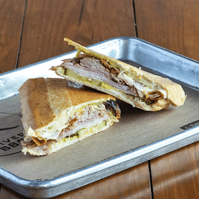 The Cuban sandwich gets the smokehouse treatment, a diplomatic alliance between Tampa tradition and barbecue innovation that works surprisingly well.