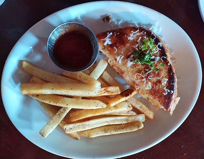 Simplicity elevated to art form &ndash; perfectly grilled bread, melty cheese, and those seasoned fries standing at attention, ready for their dipping destiny.