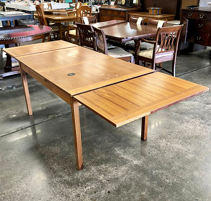 This extendable teak dining table isn't just furniture; it's the future backdrop for your family's most memorable meals and heated Monopoly tournaments.