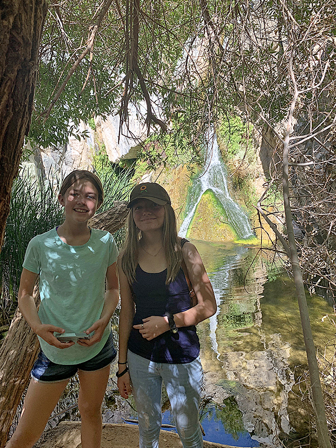 The narrow passage to Darwin Falls feels like entering a secret club where the password is "I survived the desert hike."