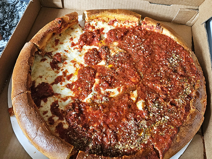 Deep dish dreams come true in this glorious construction of crust, sauce, and cheese. Not just a pizza &ndash; it's an architectural achievement.