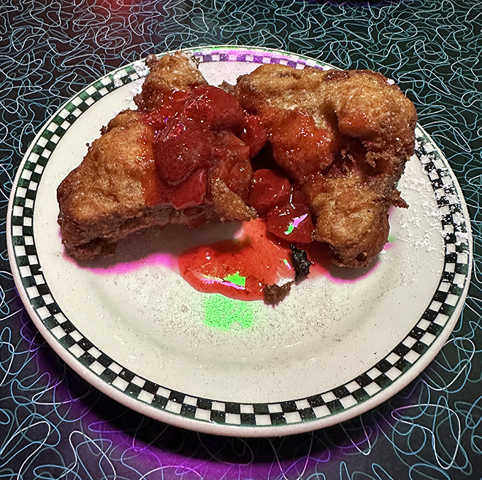 Deep-fried French toast that makes regular French toast look like it's not even trying. Crispy exterior, custardy interior, and cherry sauce that belongs in the Condiment Hall of Fame.