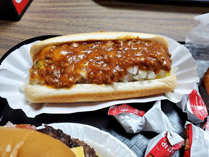 Chili dogs aren't just food; they're edible nostalgia. This one's loaded with enough homestyle chili to make your cardiologist wince.