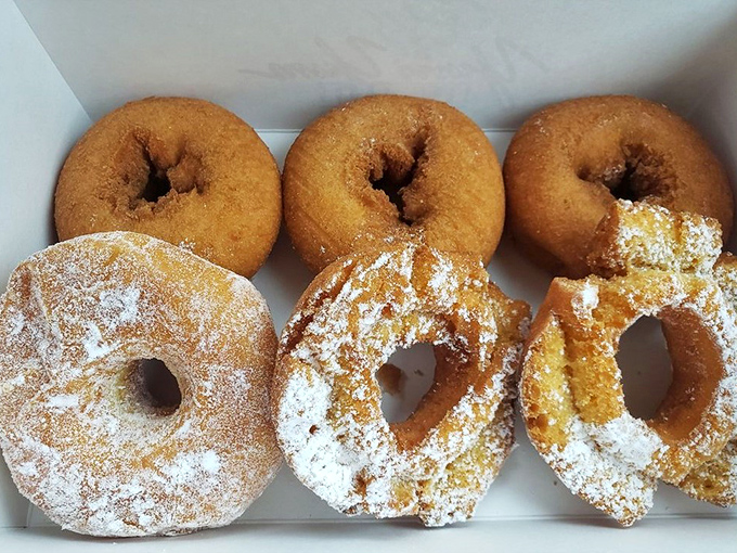The powdered sugar donuts sit like snow-capped mountains of joy, waiting to leave their delicious evidence all over your shirt.