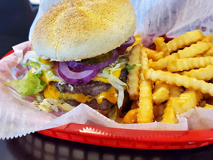 This isn't just a burger; it's edible architecture&mdash;layers of beef, cheese, and fresh toppings creating a perfect harmony of flavors.