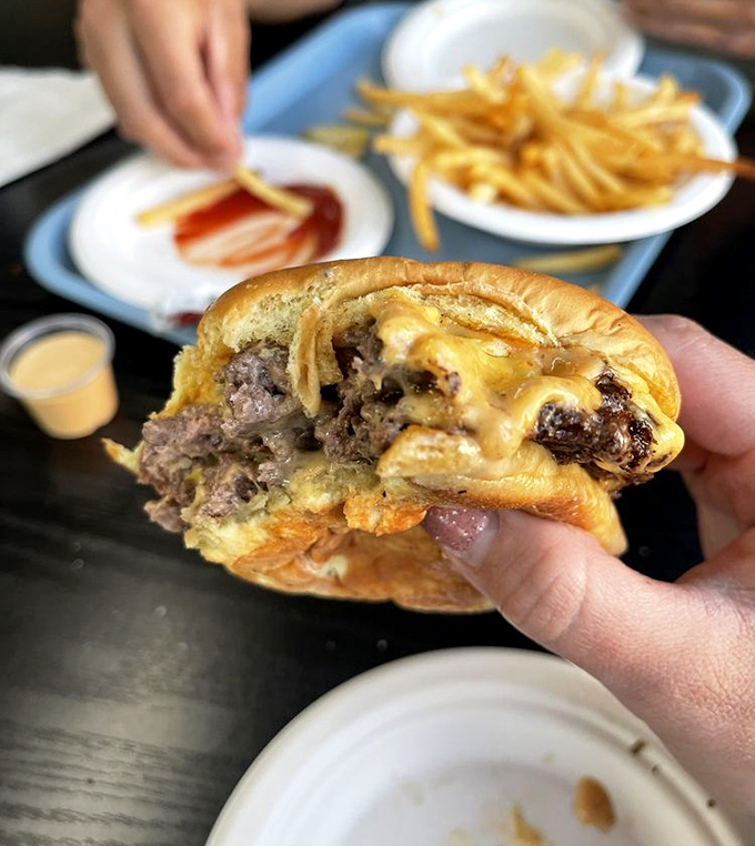 The double cheeseburger: where beef, cheese, and bun achieve that mythical harmony musicians spend lifetimes trying to capture in three minutes.