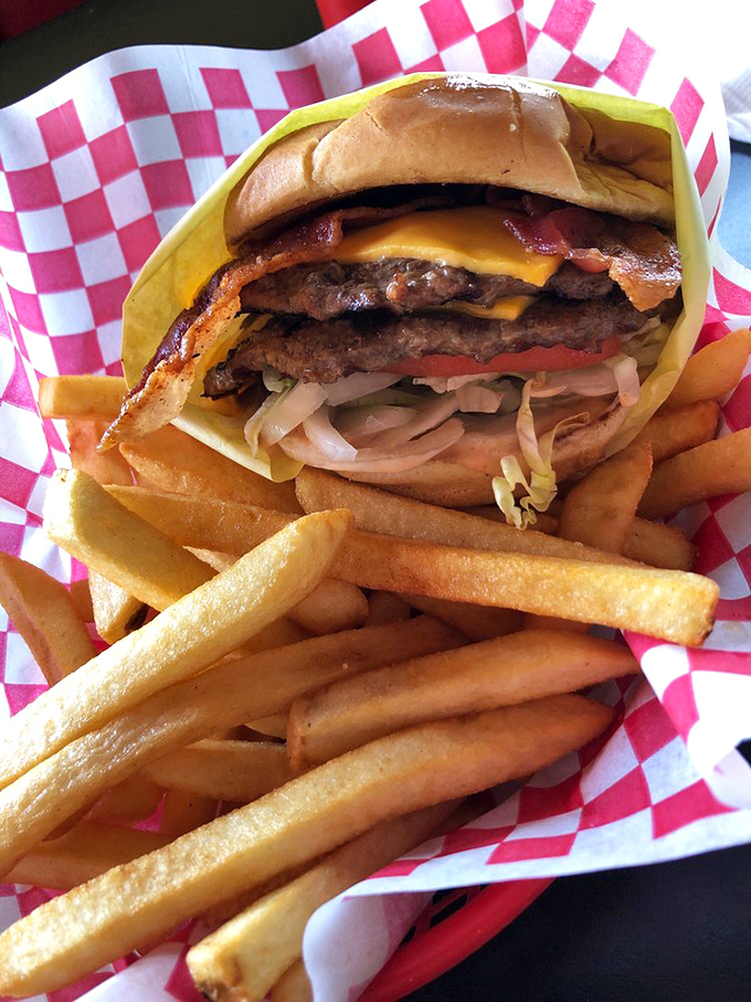 Architectural masterpiece or lunch? This towering double bacon cheeseburger answers the age-old question: "Can you ever have too much of a good thing?"