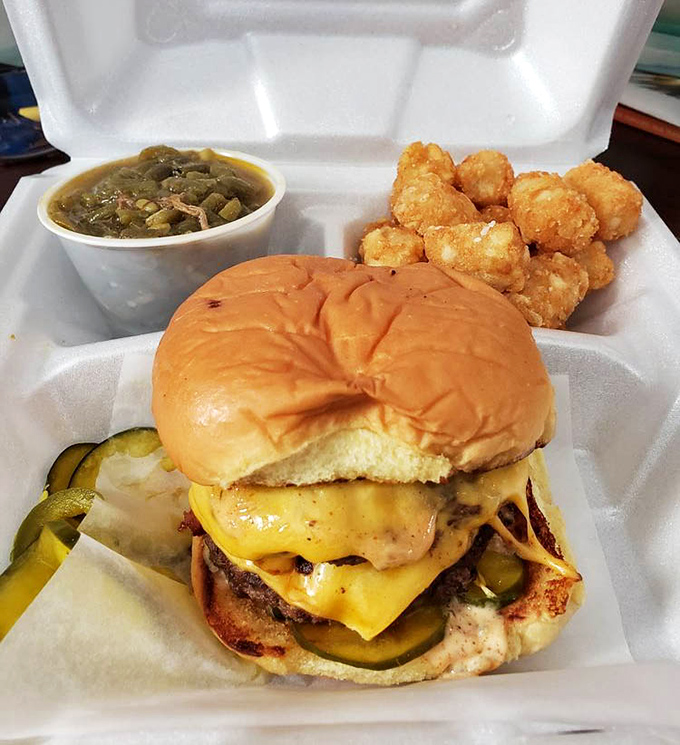 When a sandwich requires this much structural integrity, you know you're in for something special. Those tater tots look like little golden nuggets of joy.