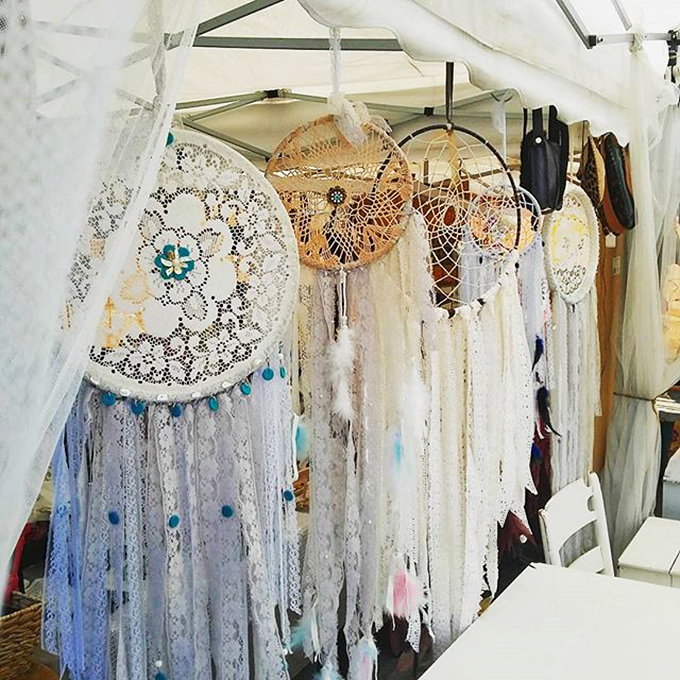Dreamcatchers sway gently in the breeze, their intricate webbing promising to filter nightmares while adding bohemian charm to any bedroom wall.