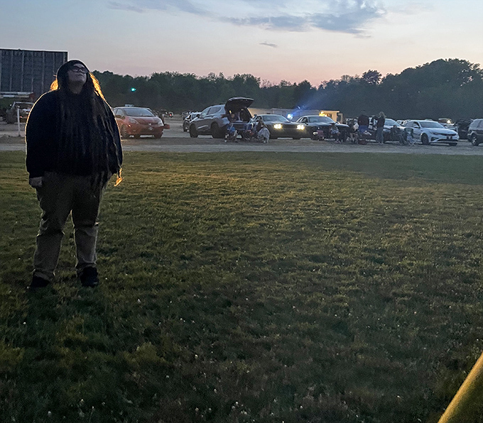 As twilight settles over the drive-in, moviegoers prepare for showtime. That magical moment between day and night when anticipation peaks.