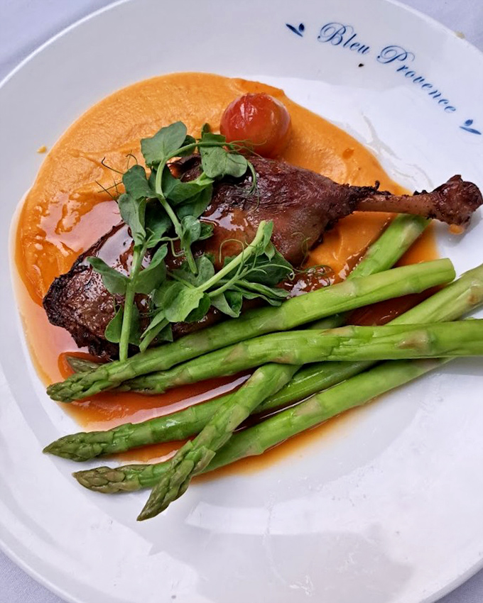 Duck confit that's spent more time getting ready than I did for my high school prom, resulting in perfectly crisp skin and tender meat.