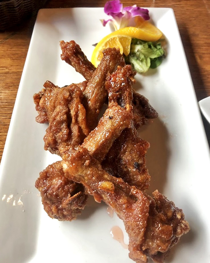 These aren't your average wings—they're duck wings with a glaze so good you'll be contemplating licking your fingers in public. Go ahead, we won't judge.