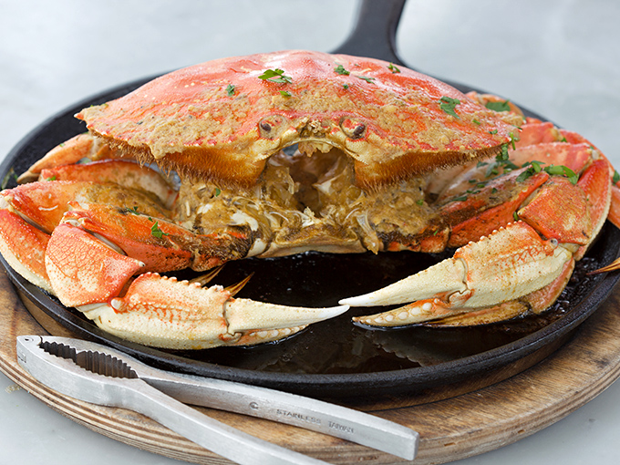 This Dungeness crab isn't just dinner—it's a San Francisco ritual, served with the kind of theatrical presentation that demands a round of applause.