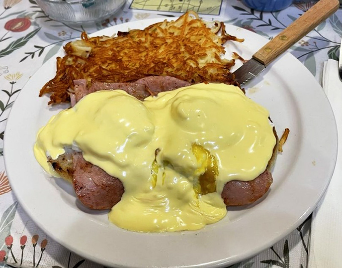 The hollandaise sauce cascades over these eggs Benedict like a golden waterfall of breakfast bliss.