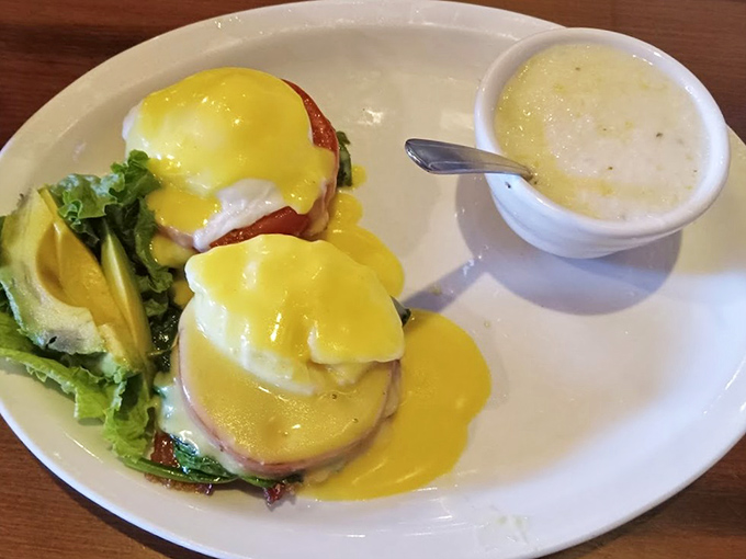 Eggs Benedict done right: perfectly poached eggs perched atop English muffins, draped in hollandaise that practically sings "The Yellow Rose of Texas."