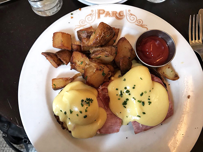 Eggs Benedict that would make a Parisian jealous. Those golden orbs of hollandaise aren't just sauce&mdash;they're liquid sunshine on a Sunday morning.