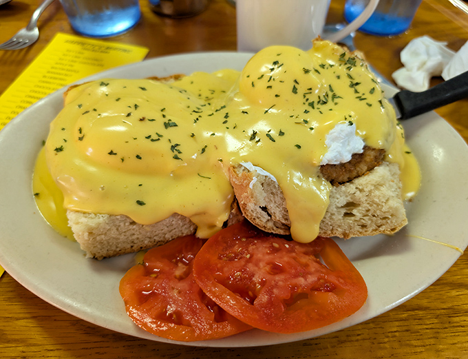 Hollandaise sauce cascading down like a yellow waterfall&mdash;this eggs benedict doesn't just satisfy hunger, it creates memories that linger longer than your suntan.