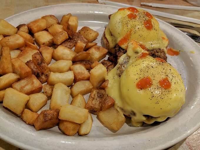 Eggs Benedict done right &ndash; where hollandaise sauce cascades down like a yellow waterfall of buttery goodness.