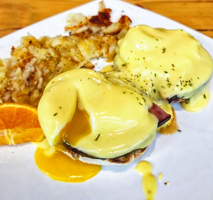 Eggs Benedict that makes you understand why people wait in line&mdash;hollandaise sauce flowing like liquid gold over perfectly poached eggs.
