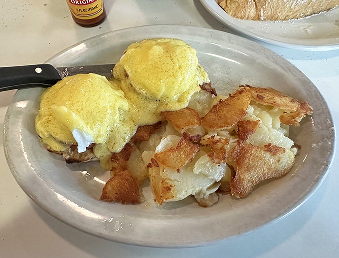 Eggs Benedict done right&mdash;golden hollandaise cascading over perfectly poached eggs. Breakfast doesn't get more beautiful than this.