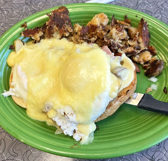 Eggs Benedict done right: perfectly poached eggs beneath a hollandaise blanket that would make any breakfast lover swoon.