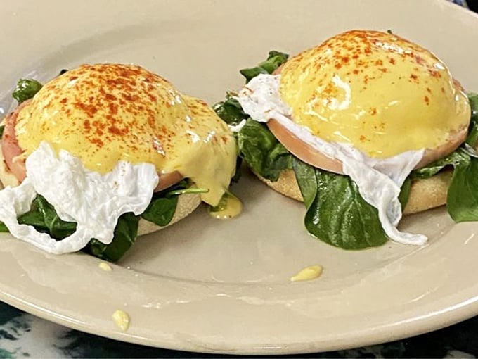 Eggs Benedict that would make Mr. Benedict himself weep with joy &ndash; poached to perfection and draped in hollandaise that's sunshine on a plate.
