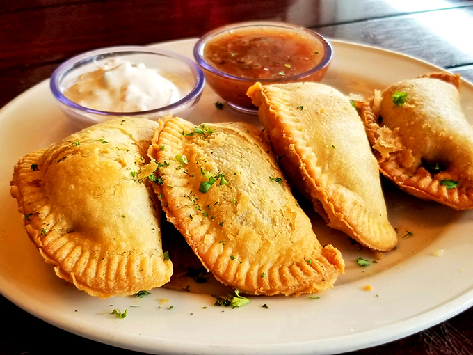 Golden empanadas with perfectly crimped edges &ndash; little half-moon treasures that crunch like your favorite vacation memory being formed in real-time.