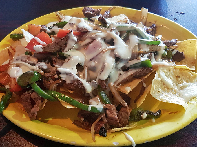 Steak fajita nachos that make sharing a moral dilemma&mdash;each chip loaded with enough toppings to qualify as its own mini-meal.