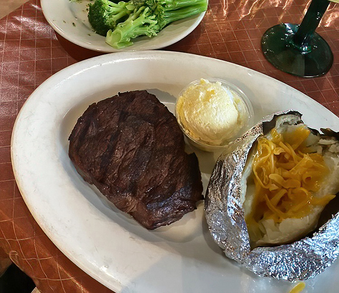 A mesquite-grilled filet mignon shares the spotlight with a loaded baked potato. In the steak world, this is what we call "dressed for success."